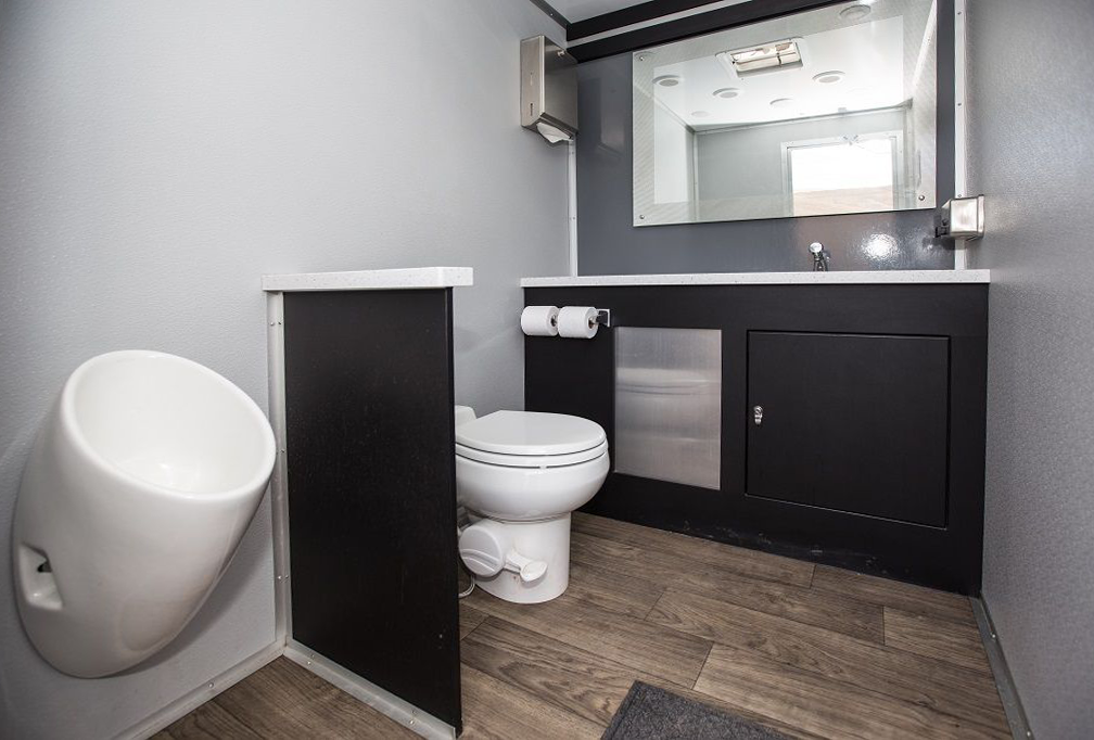 Is a divider required to separate a urinal and water closet in a single ...